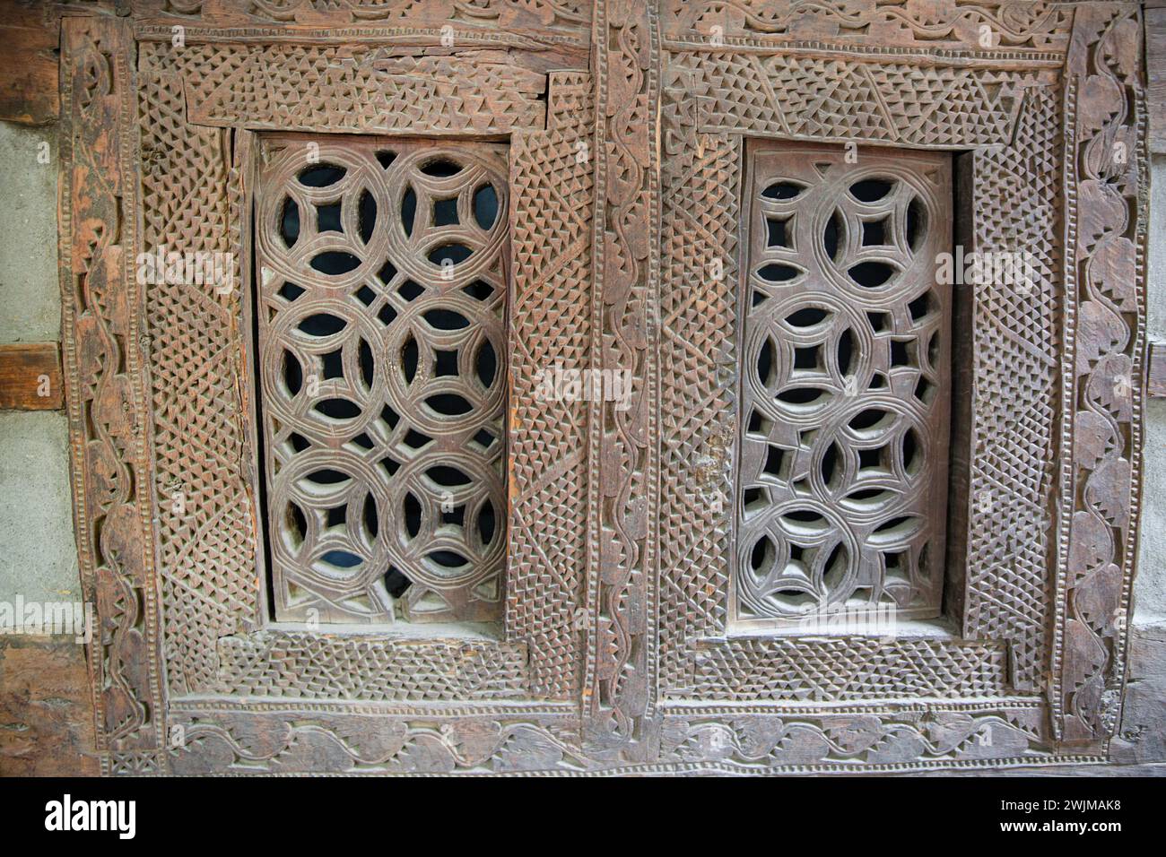 Old wooden carved building architecture in Ganish (Ganesh) village in ...