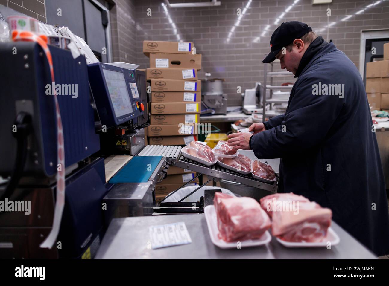 Toronto, Canada. 02nd Feb, 2024. A butcher packages meat at a Metro ...
