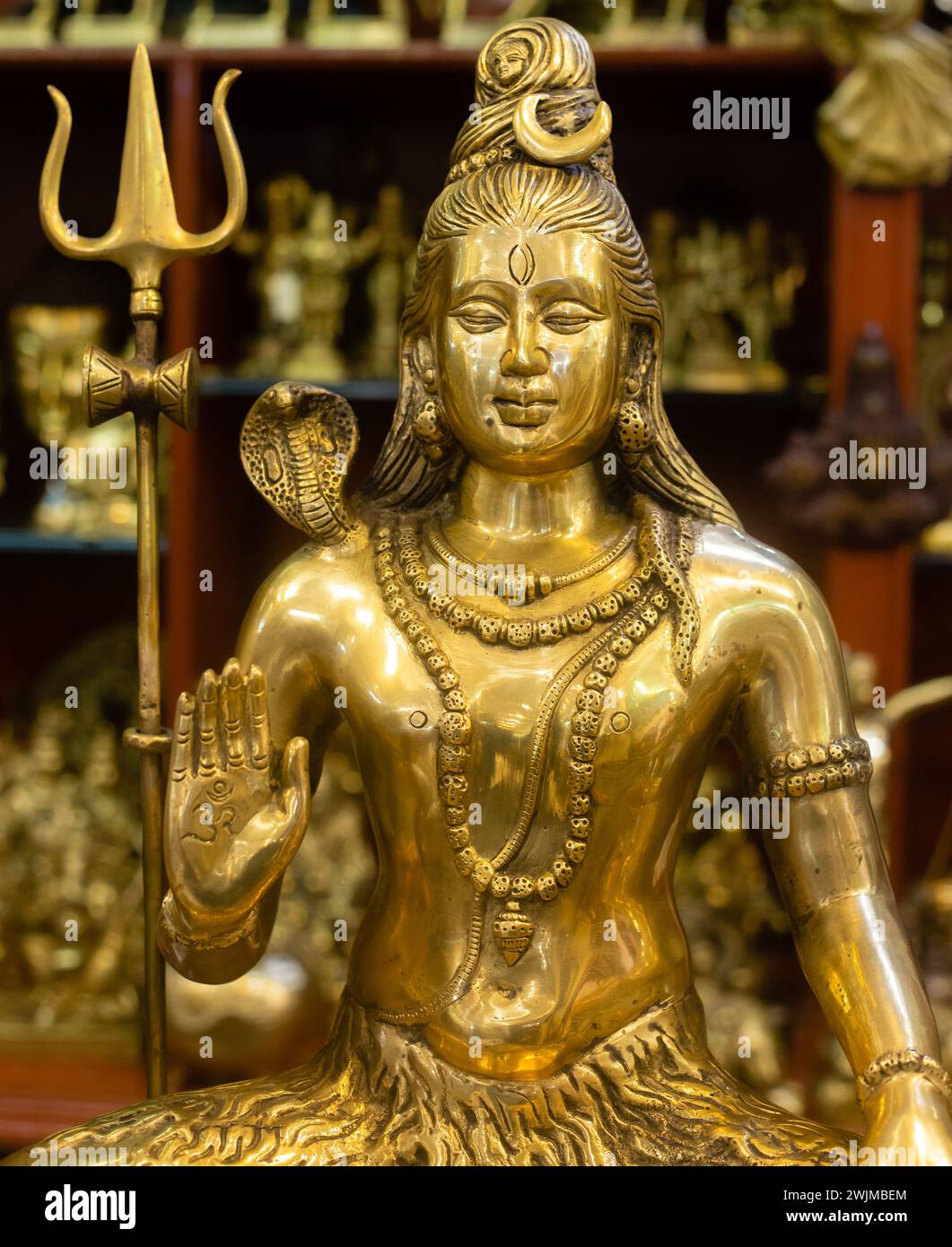 Brass idol of lord Shiva along with other statues being sold at an ...