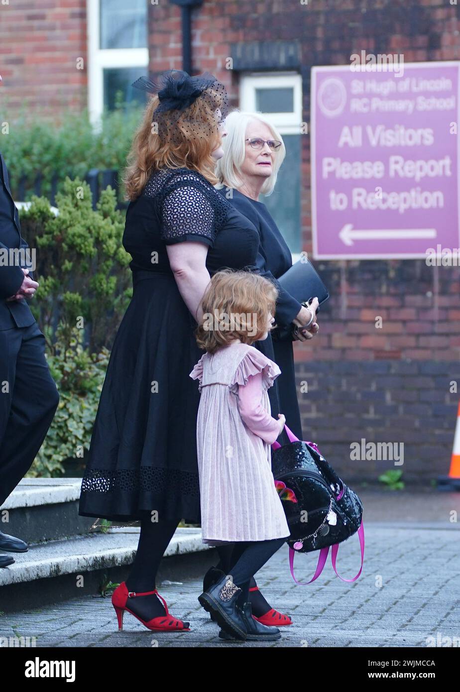 Judith Lloyd and members of the family leave the church following a ...
