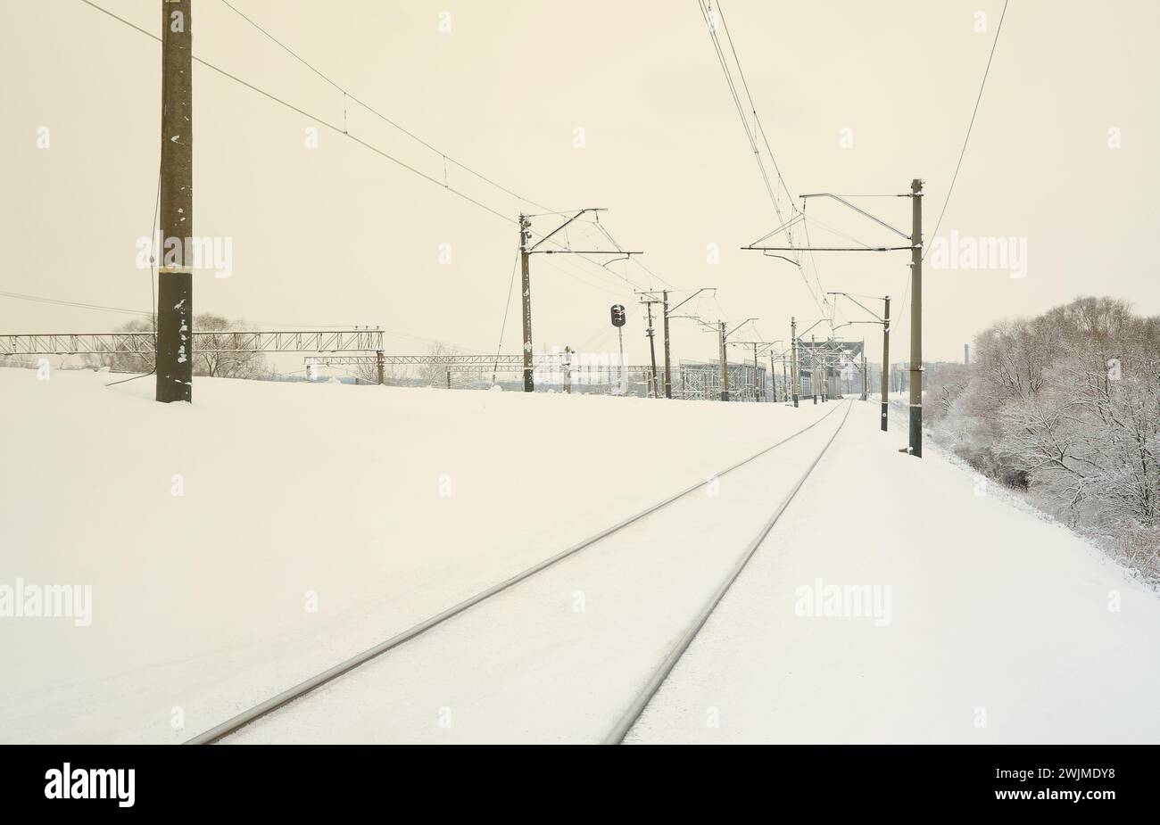 Winter railway landscape, Railway tracks in the snow-covered industrial ...