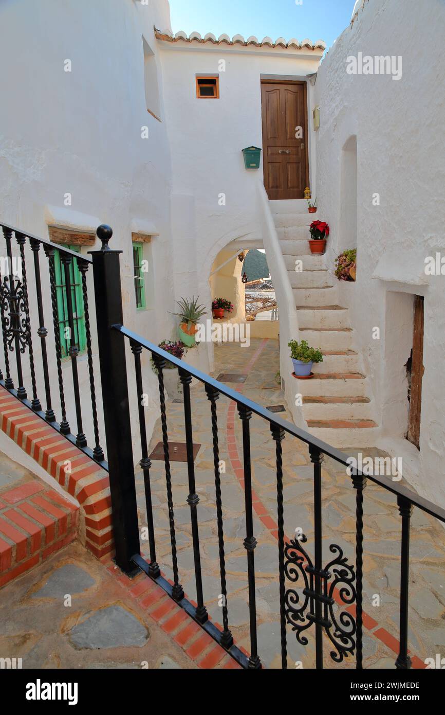 Picturesque narrow and steep cobbled alleys in Salares, Axarquia ...