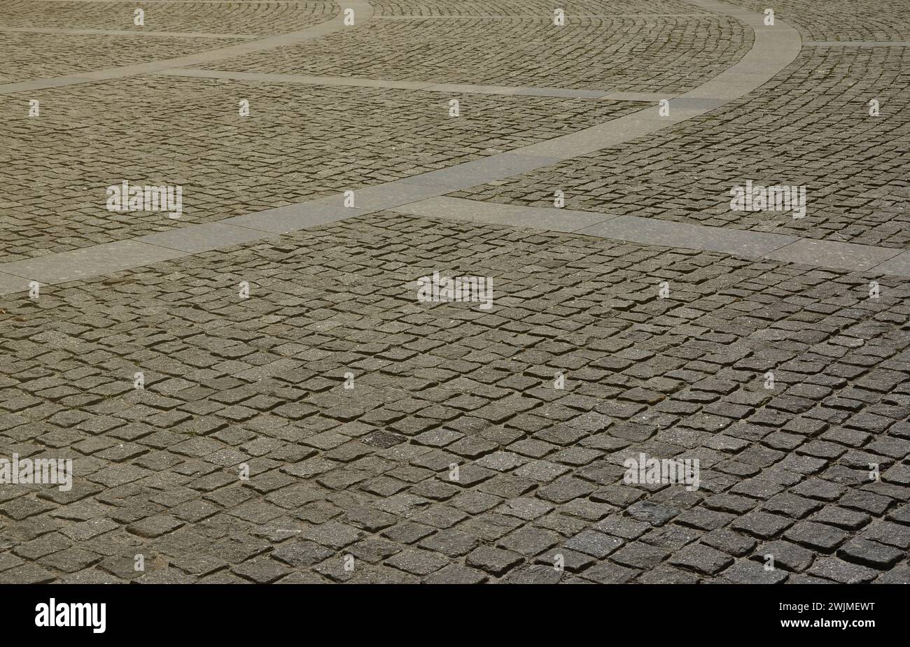 The texture of the paving slab (paving stones) of many small stones of ...