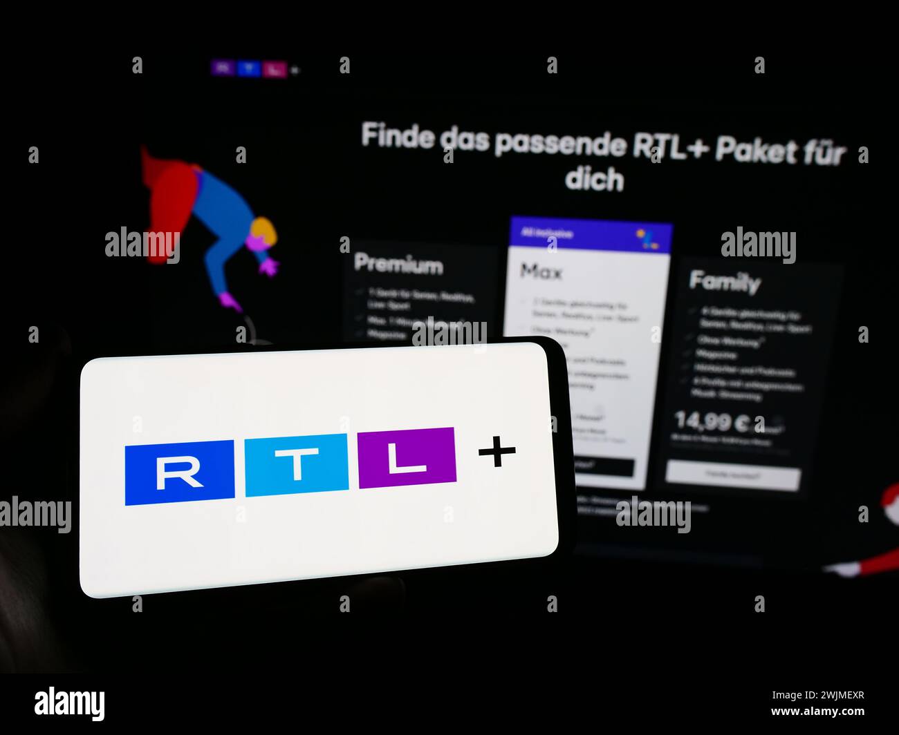 Person holding smartphone with logo of German entertainment platform ...
