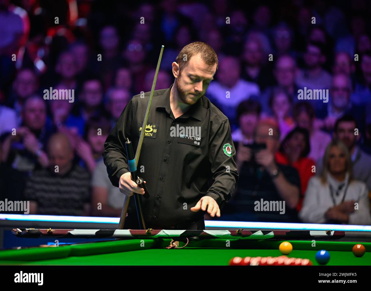 Mark Allen sets up his cue ahead of the match, during the 2024 ...