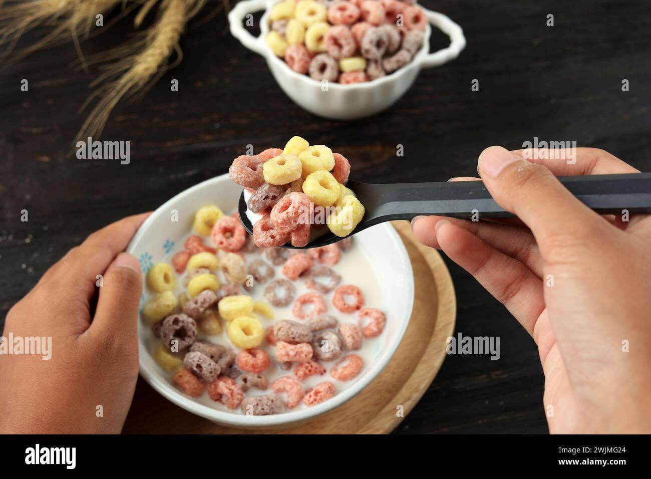 Fruit loops cereal kid hand hi-res stock photography and images - Alamy