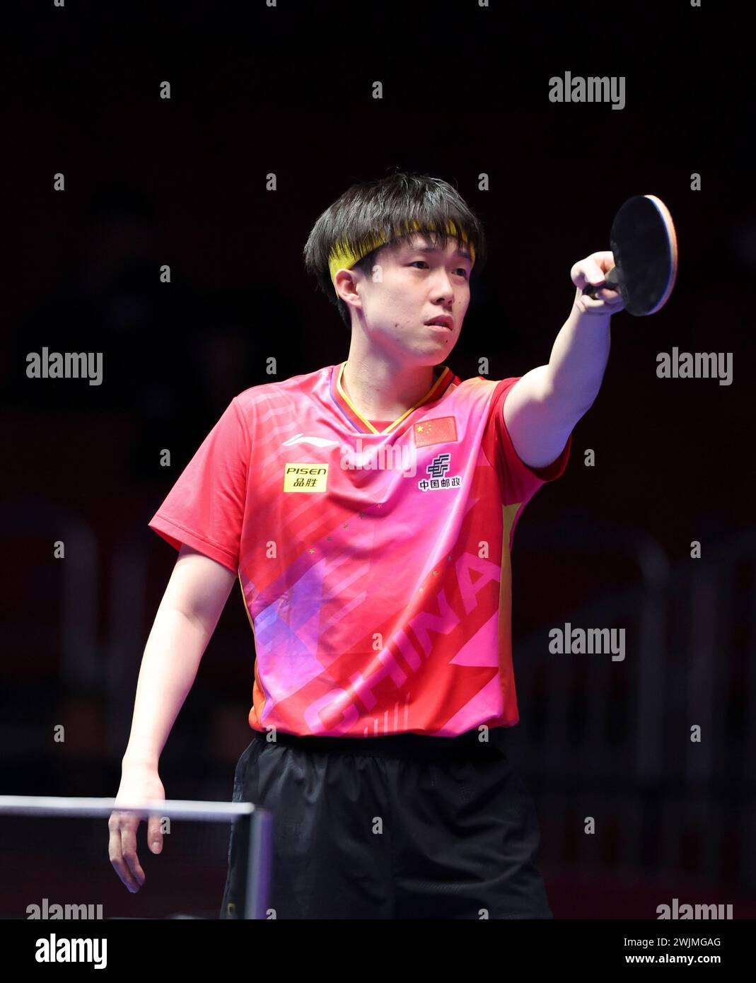 Busan, South Korea. 16th Feb, 2024. Wang Chuqin of China points to the tribune while competing ...