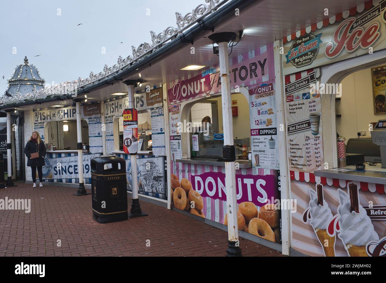 Traditional fast food kiosks on Brighton pier in winter Stock Photo - Alamy