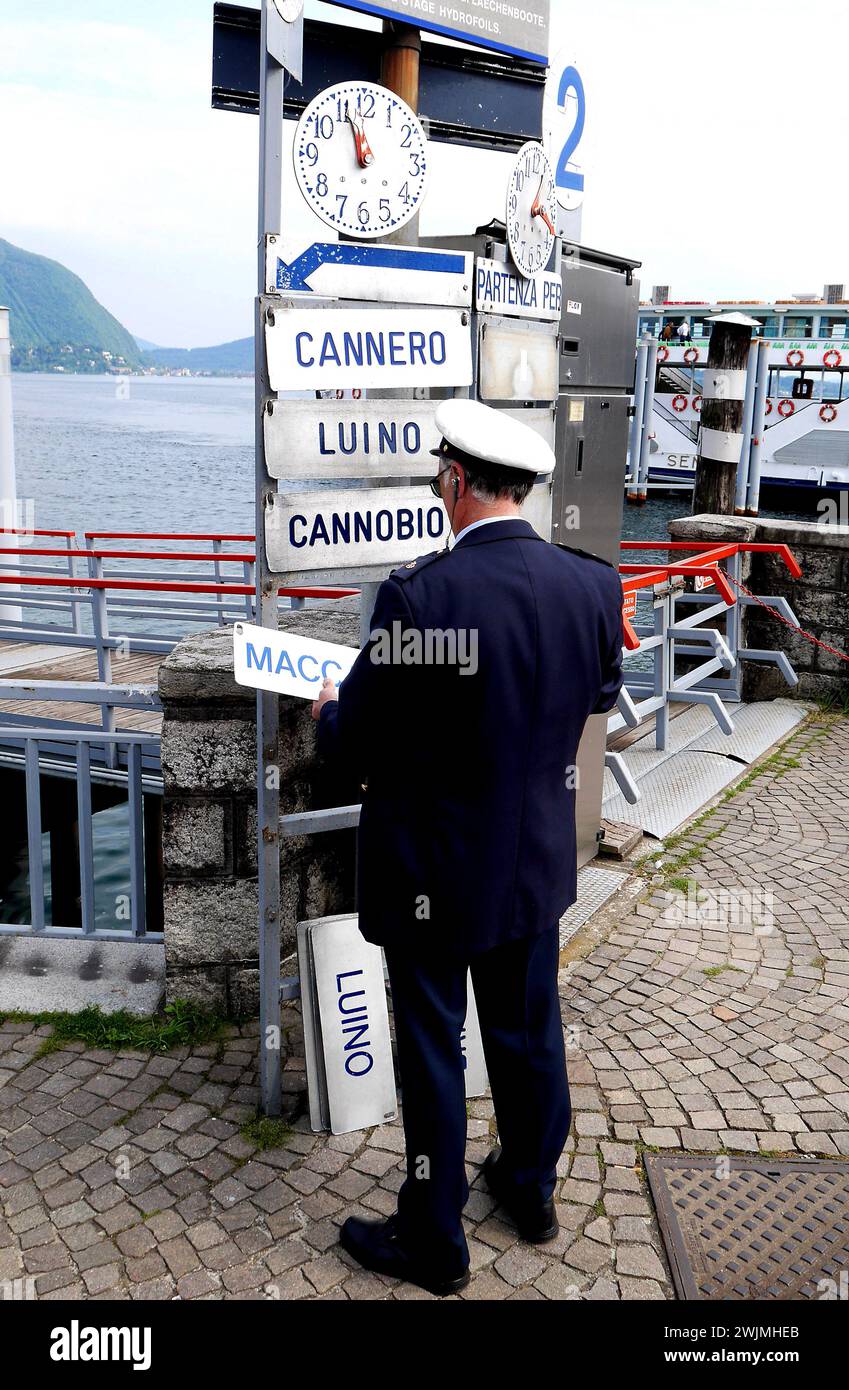 Captain changes the signs of the departure points for the ferry in ...