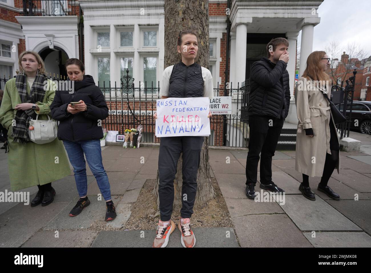 Protesters stand opposite the Russian Embassy in London, Friday, Feb ...