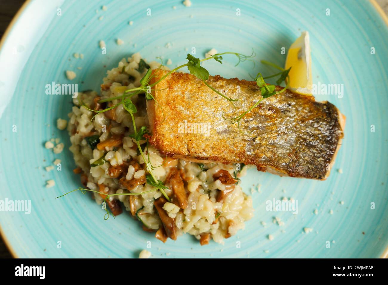 Grilled Salmon with risotto and chanterelle mushrooms Stock Photo - Alamy