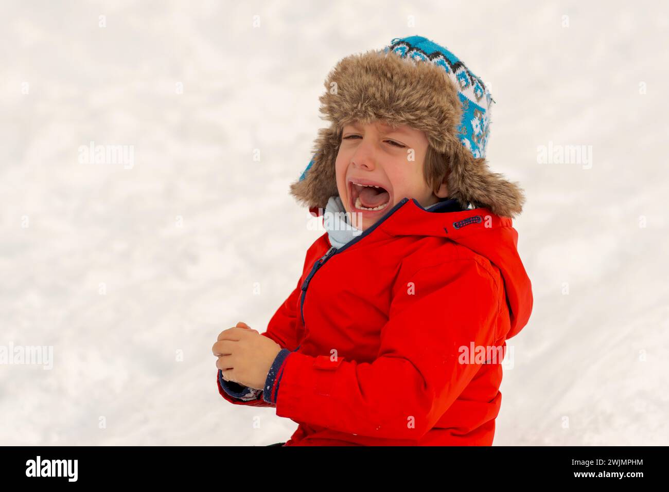 Cute boy crying with frozen hands, winter time childhood Stock Photo ...