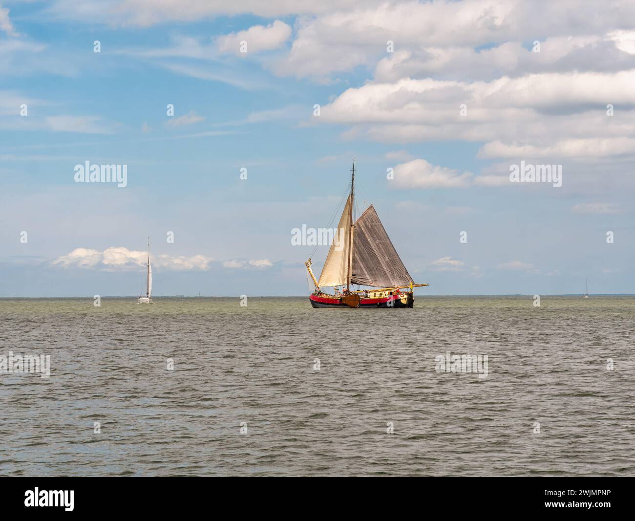 Historic tjalk charter ship sailing on IJsselmeer lake in the ...