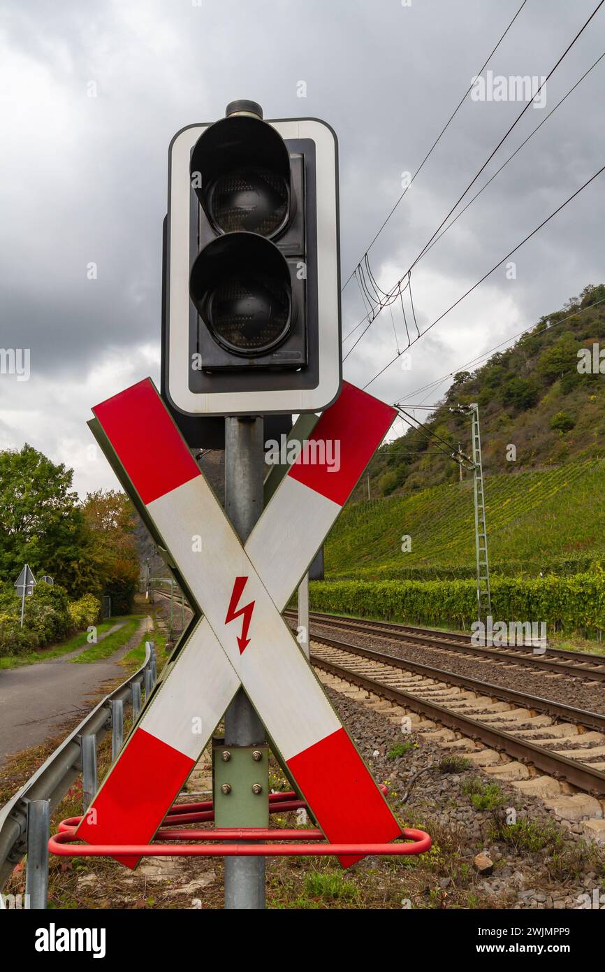 Red and white traffic sign for railroad crossing with a switched off ...