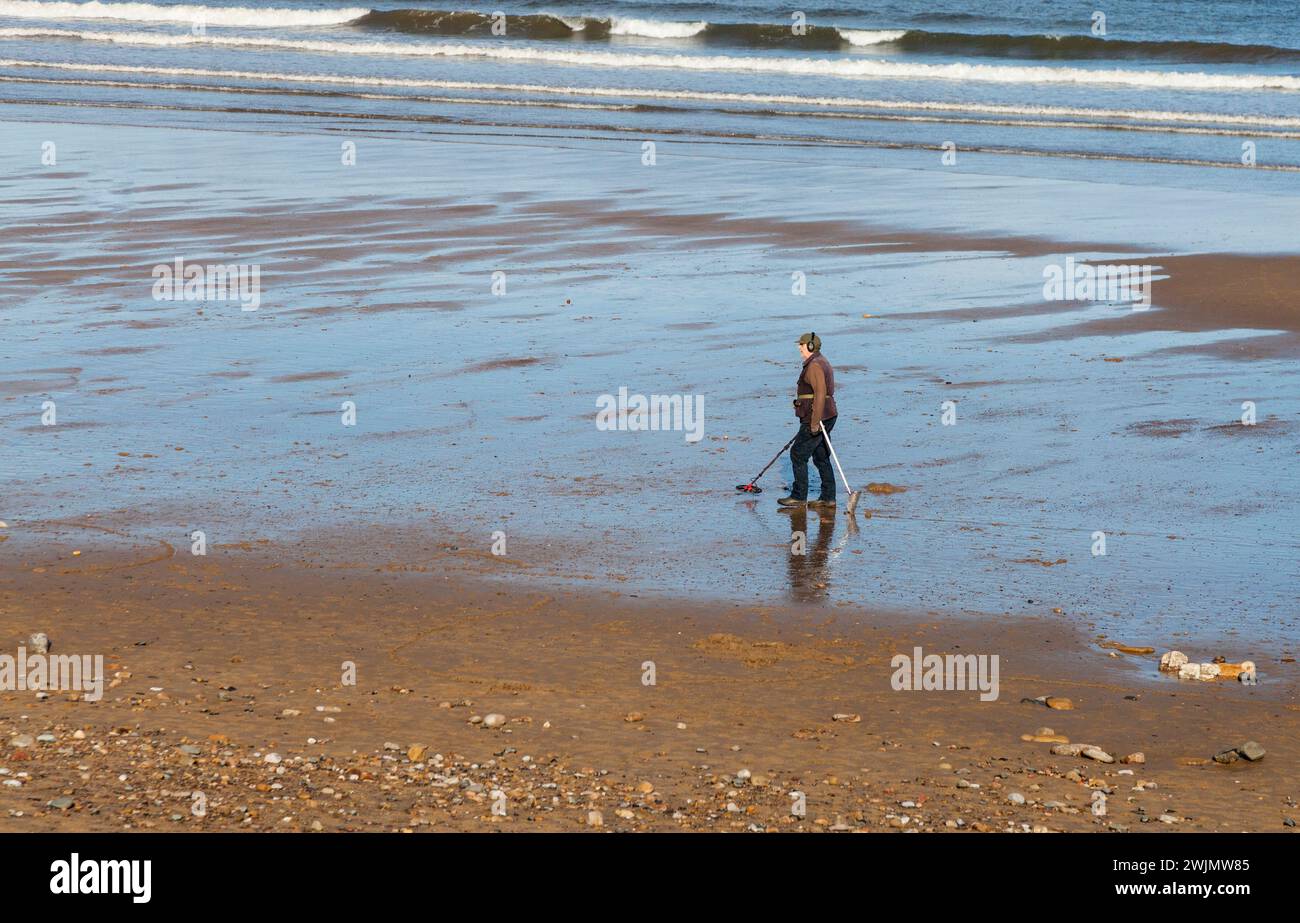 Metal detectorists search the beach area at Saltburn by the Sea ...