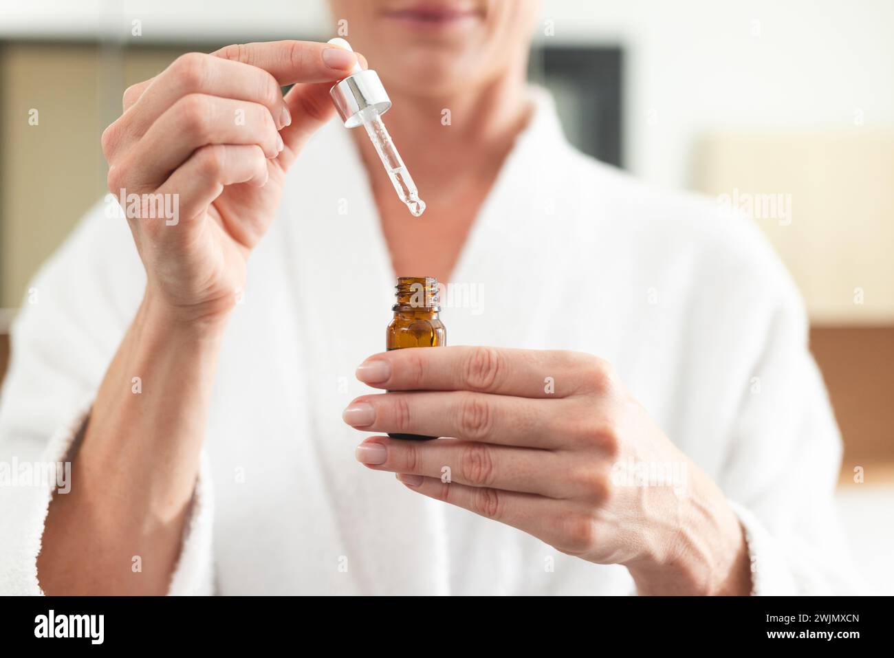 Woman serum face applying hi-res stock photography and images - Alamy