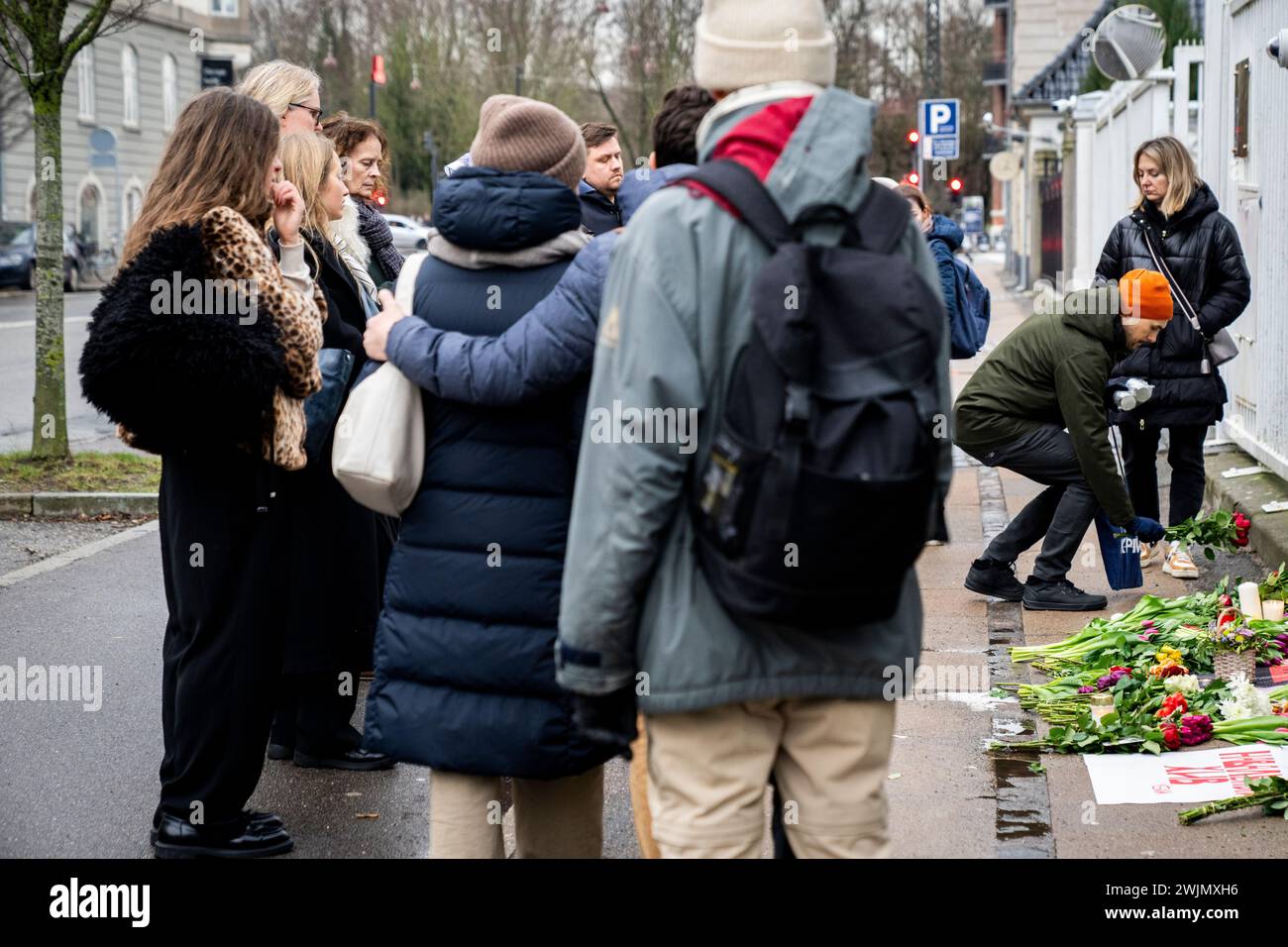 Flowers is placed and people gathers in front of the Russian embassy in ...