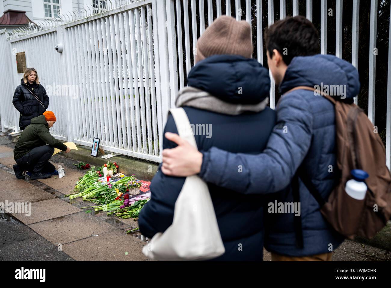 Flowers is placed and people gathers in front of the Russian embassy in ...