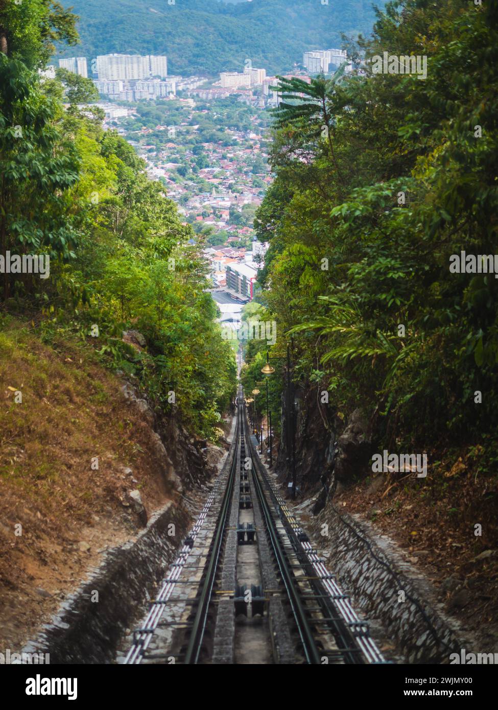 Cable car or tram uphill in Penang Malaysia. The Penang Hill Railroad track. View of the ...