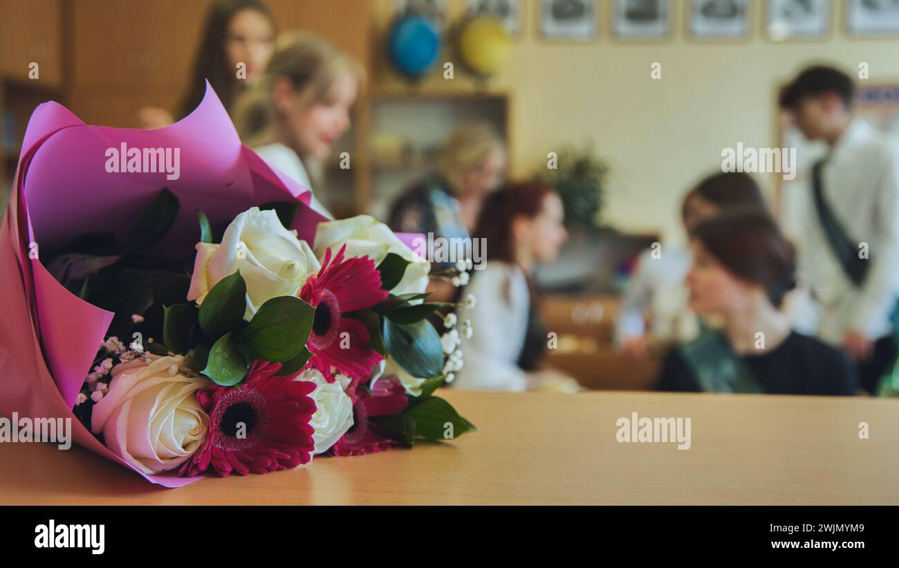 First day of school. Flowers lie on the table to celebrate the day of school Stock Photo - Alamy