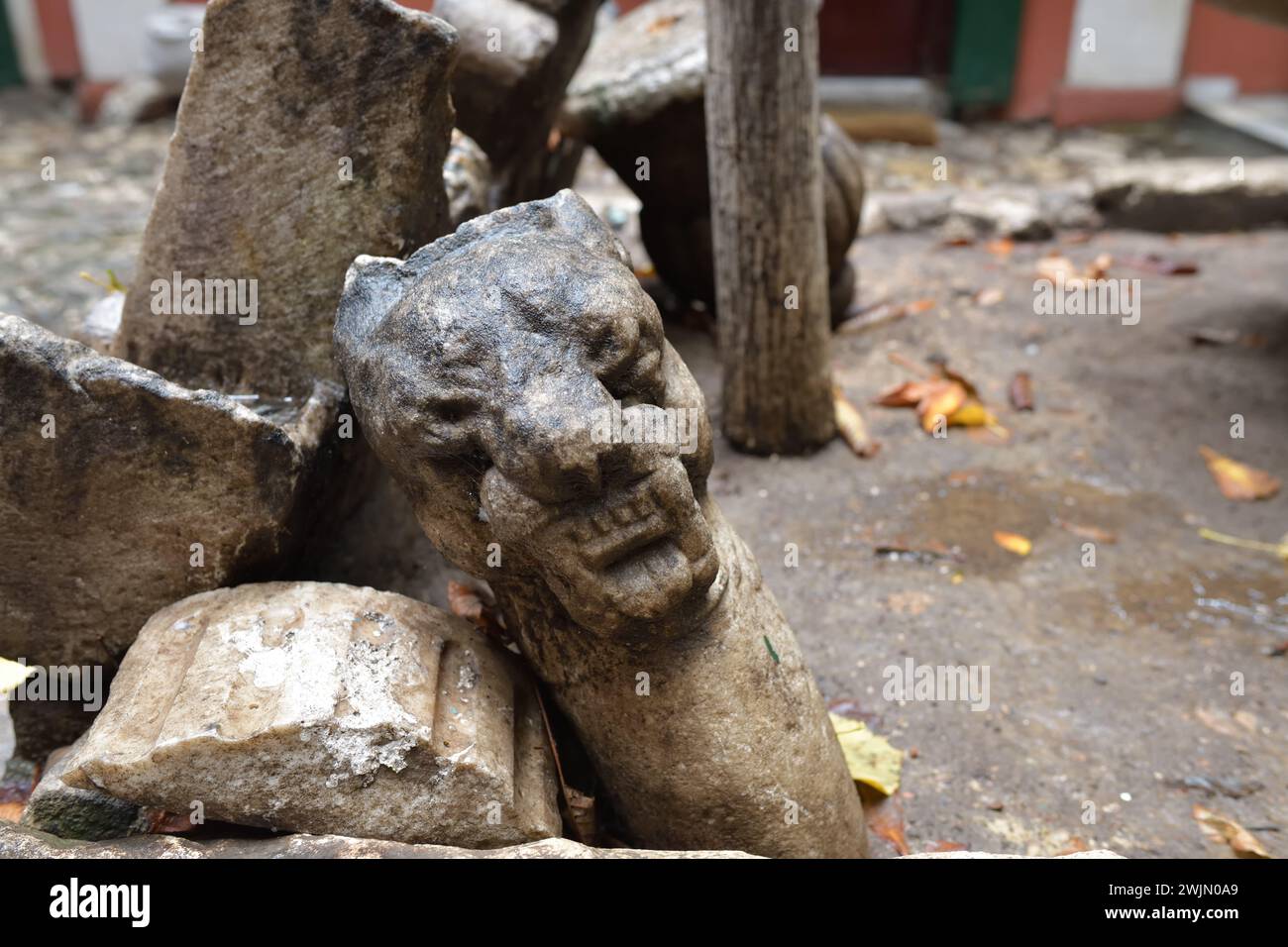Marble fragments of Byzantine columns and the head of a gargoyle in the ...