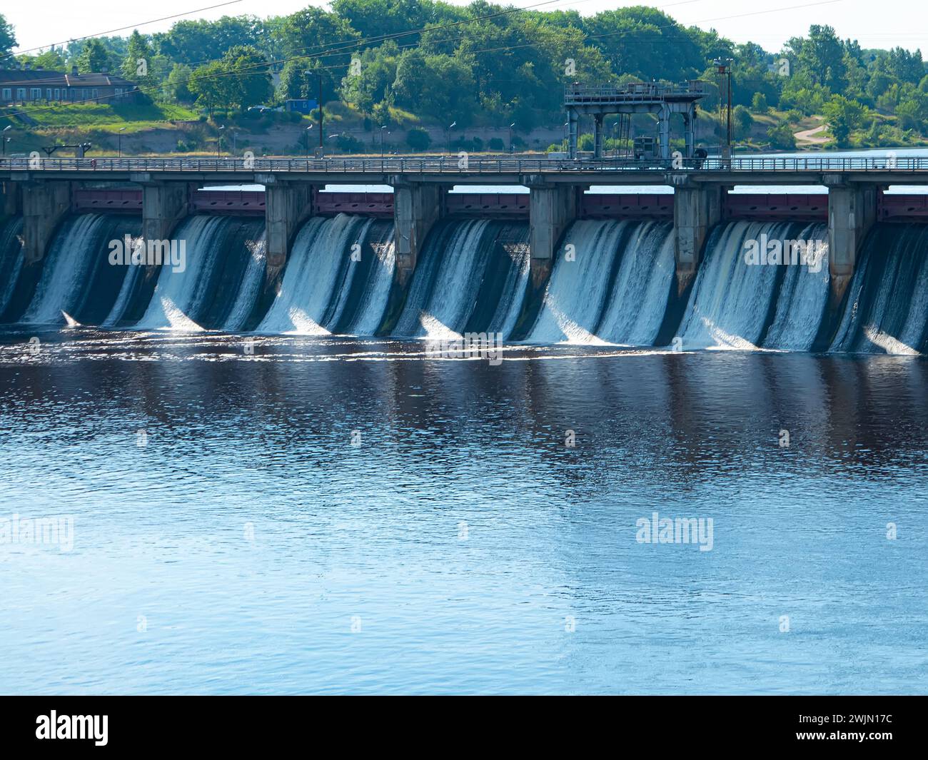 Hydroelectric power station on the northern river. Spillway control dam ...
