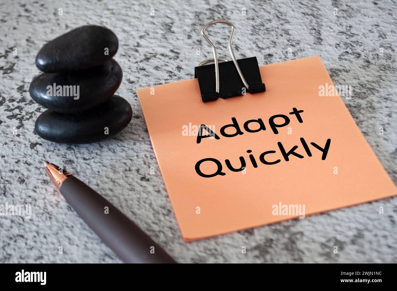 Adapt quickly text on notepad with zen stones and pen background ...