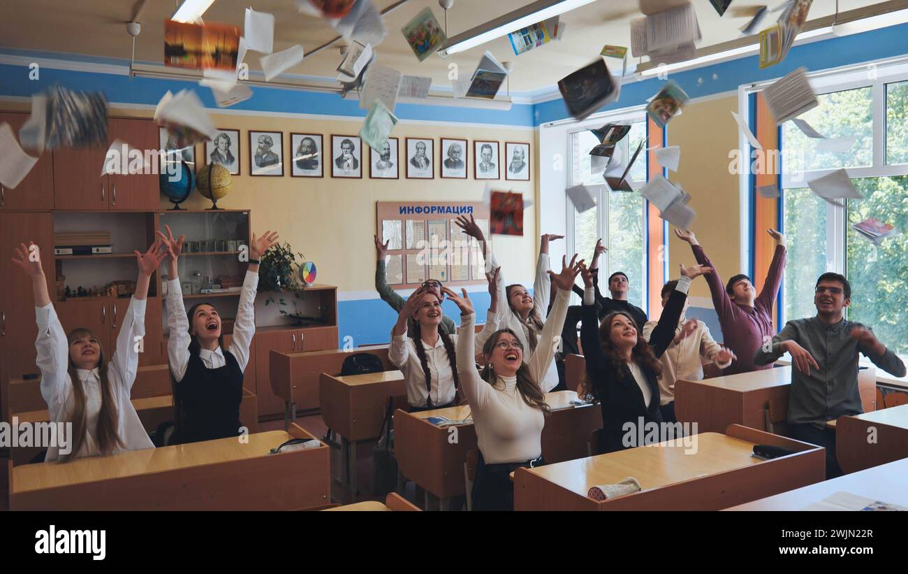 Students throwing books up hi-res stock photography and images - Alamy