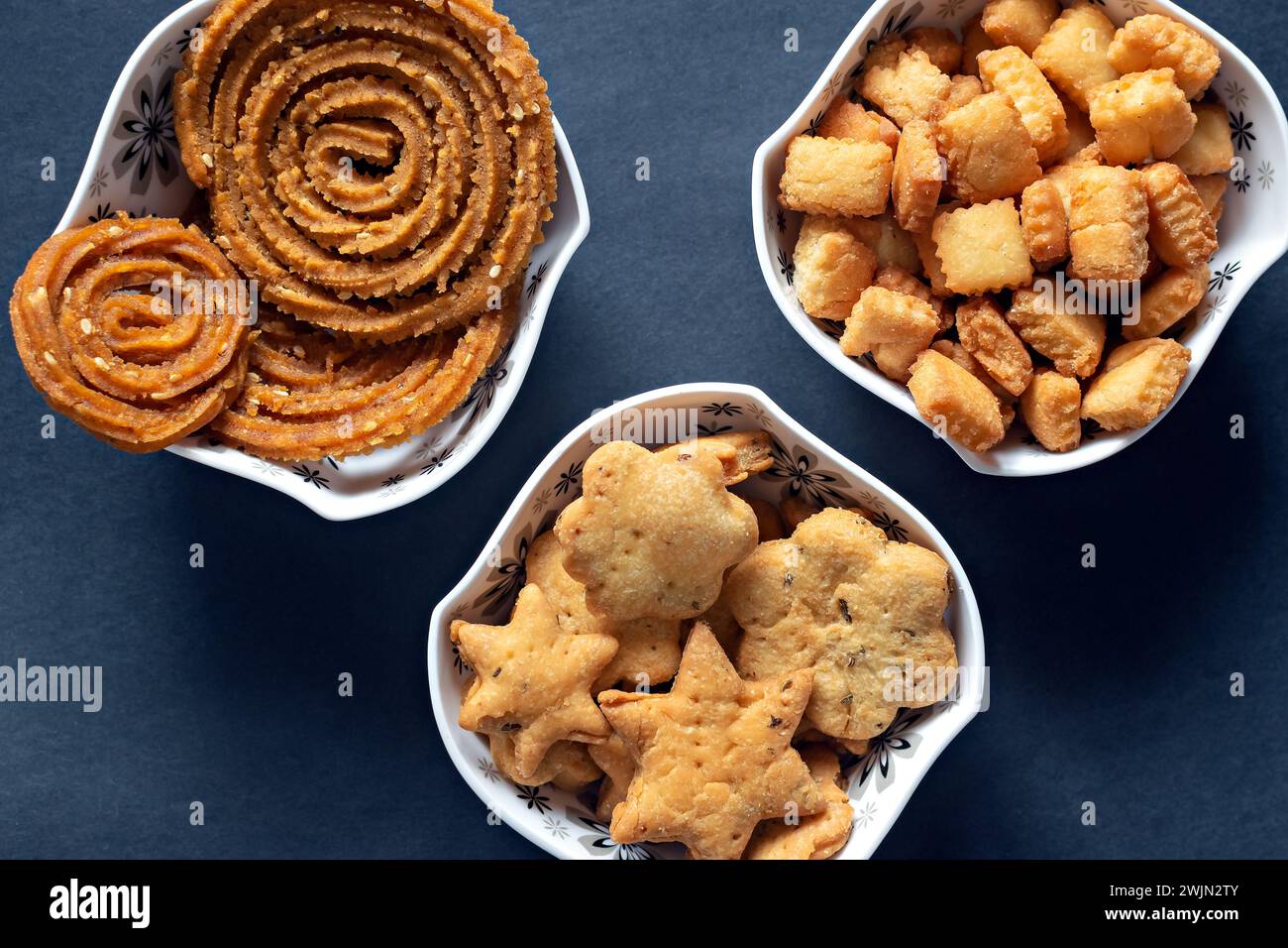 Close up photo of assorted , fresh Diwali snacks or faral items filled ...