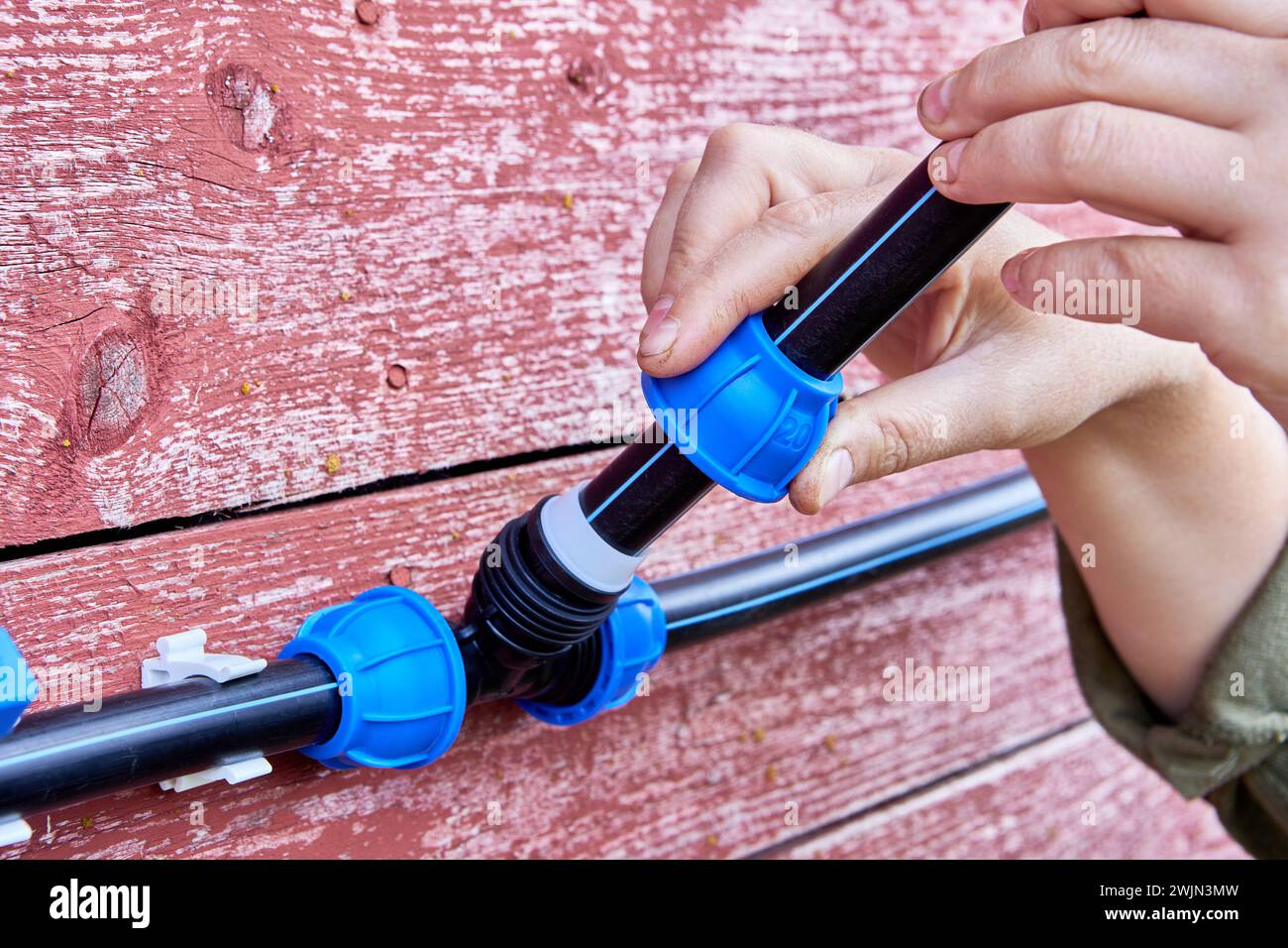 Installation of irrigation water supply with PVC pipe tee way ...