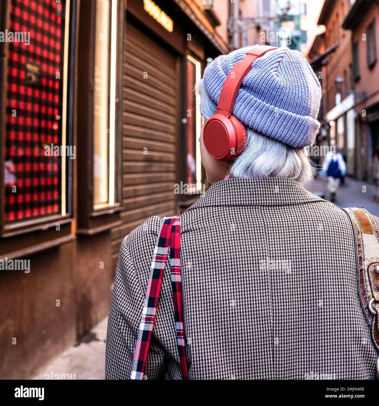 Vibrant urban chic: stylish gen z trendsetter in checkered coat and red ...