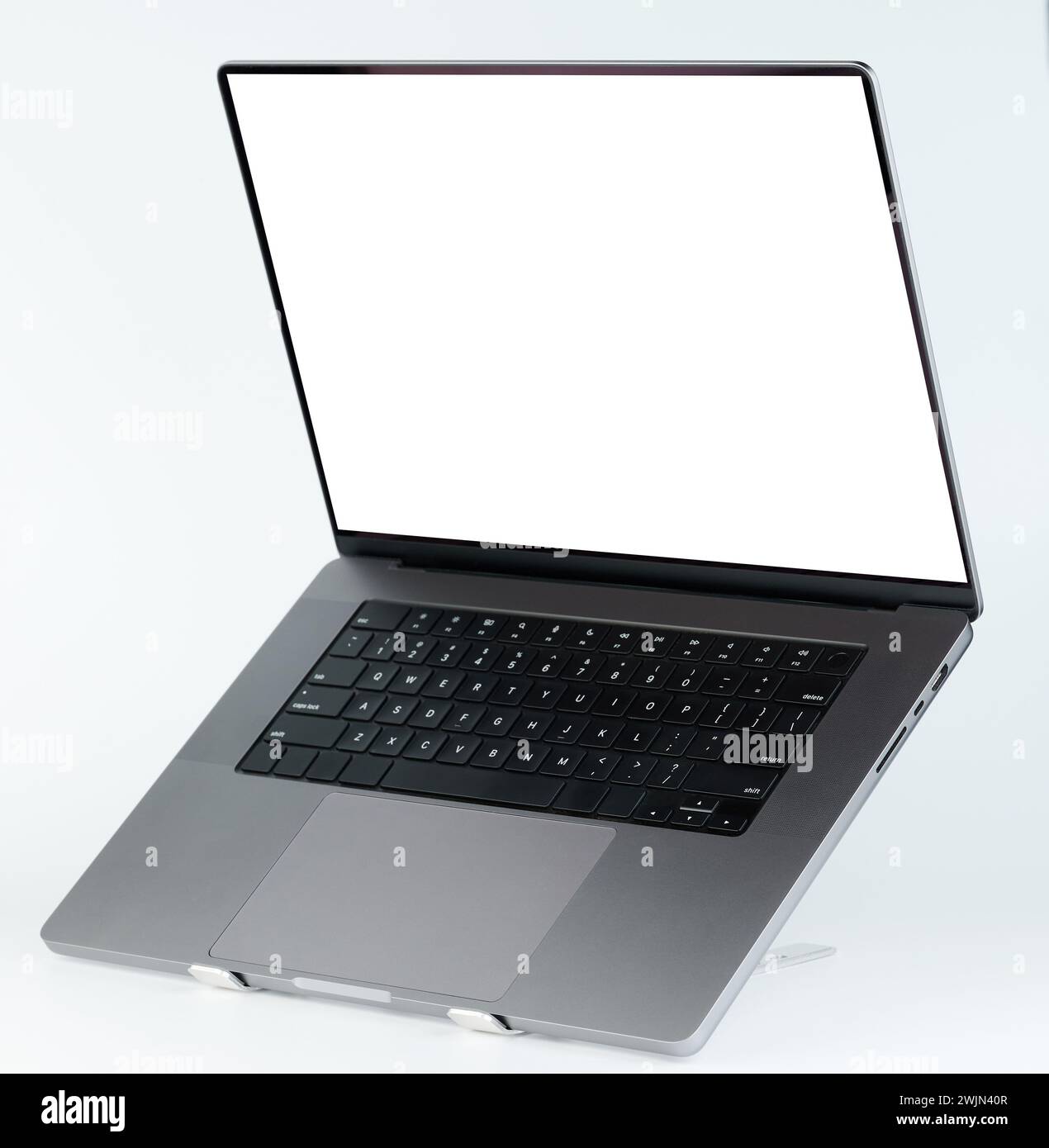 Modern laptop on stand side perspective view isolated Stock Photo - Alamy