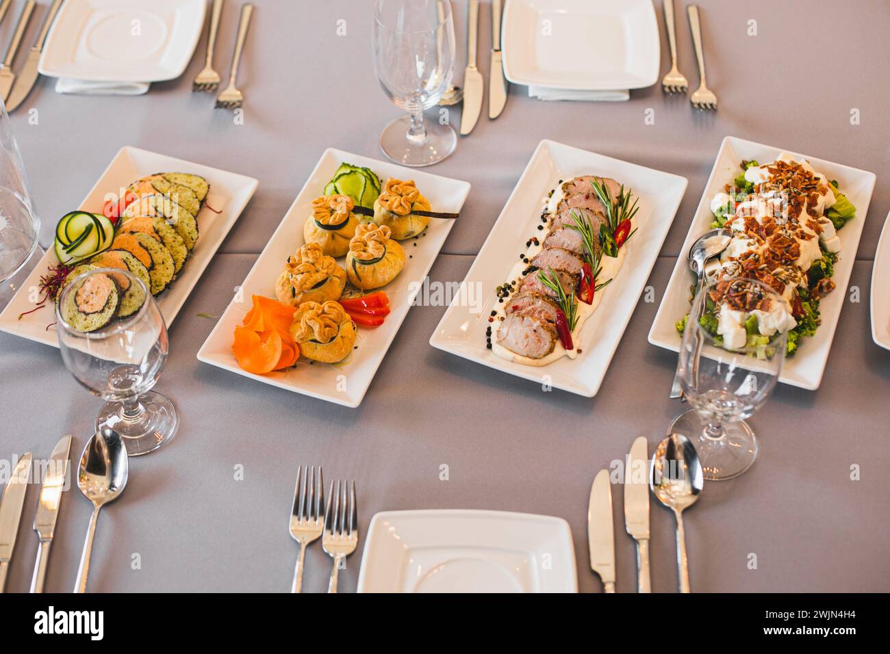 Assortment of various light snacks from meat, salad, fish is on table ...