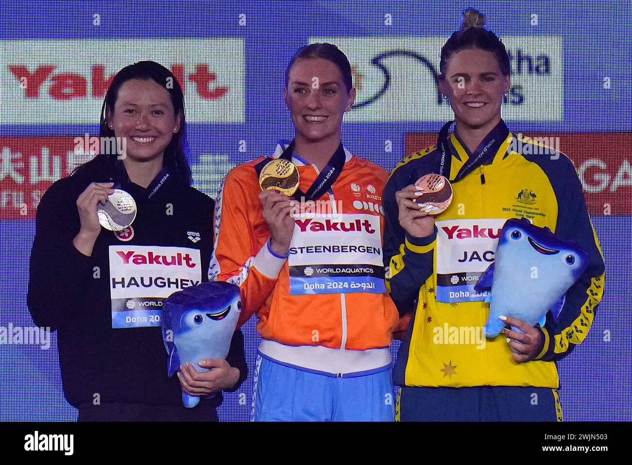 Marrit Steenbergen of the Netherlands, center, holds up her gold medal in the women's 100m ...