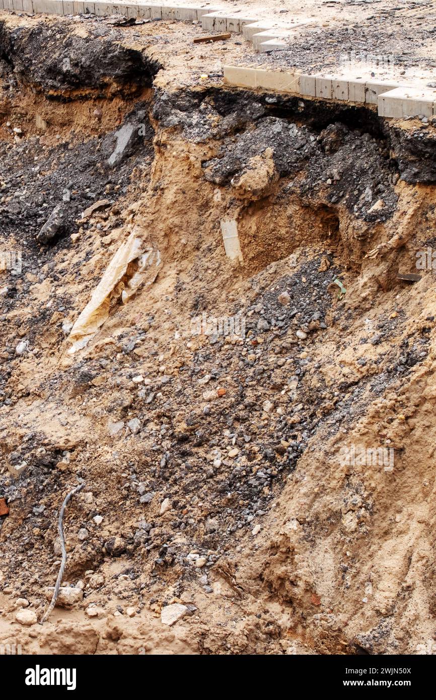 Construction pit with sand and pipes close up Stock Photo - Alamy