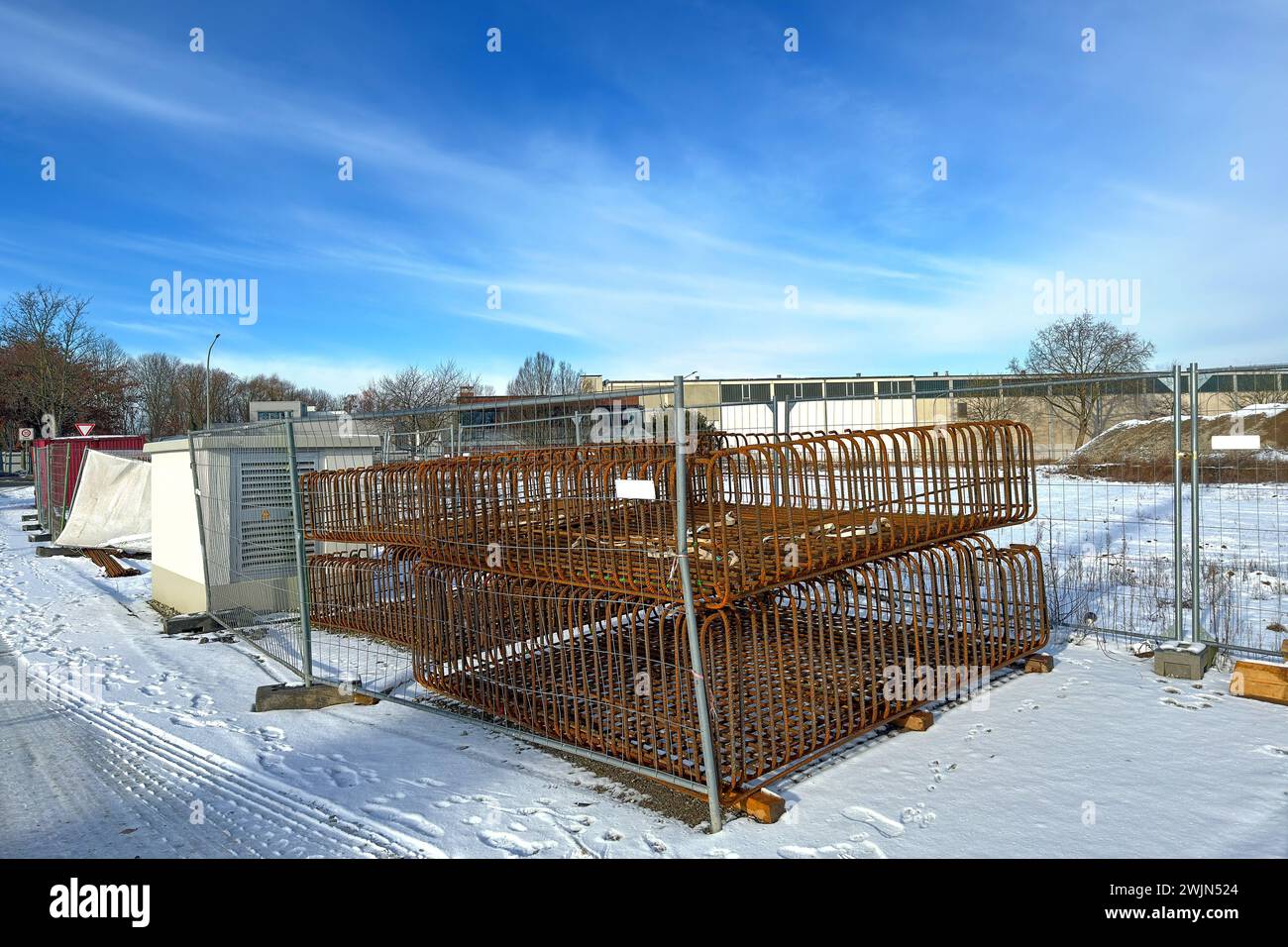 Reinforcement structures on a snow-covered construction site. Blue sky ...