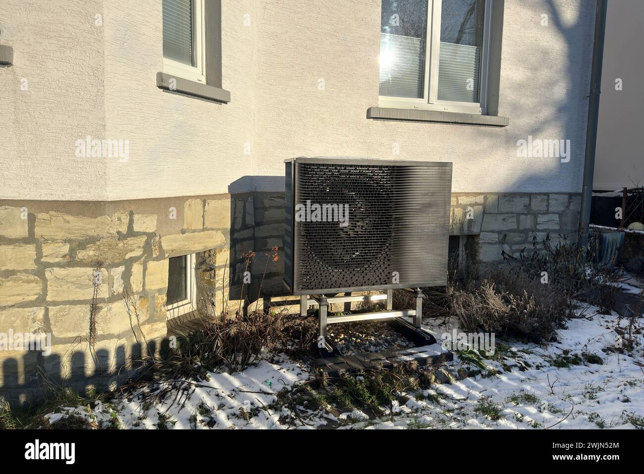 Air condition compressor for ventilating basements near a residential ...