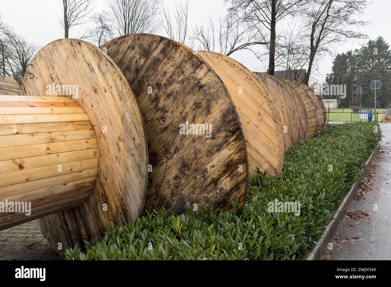 Empty wooden spools for winding electrical cables Stock Photo - Alamy