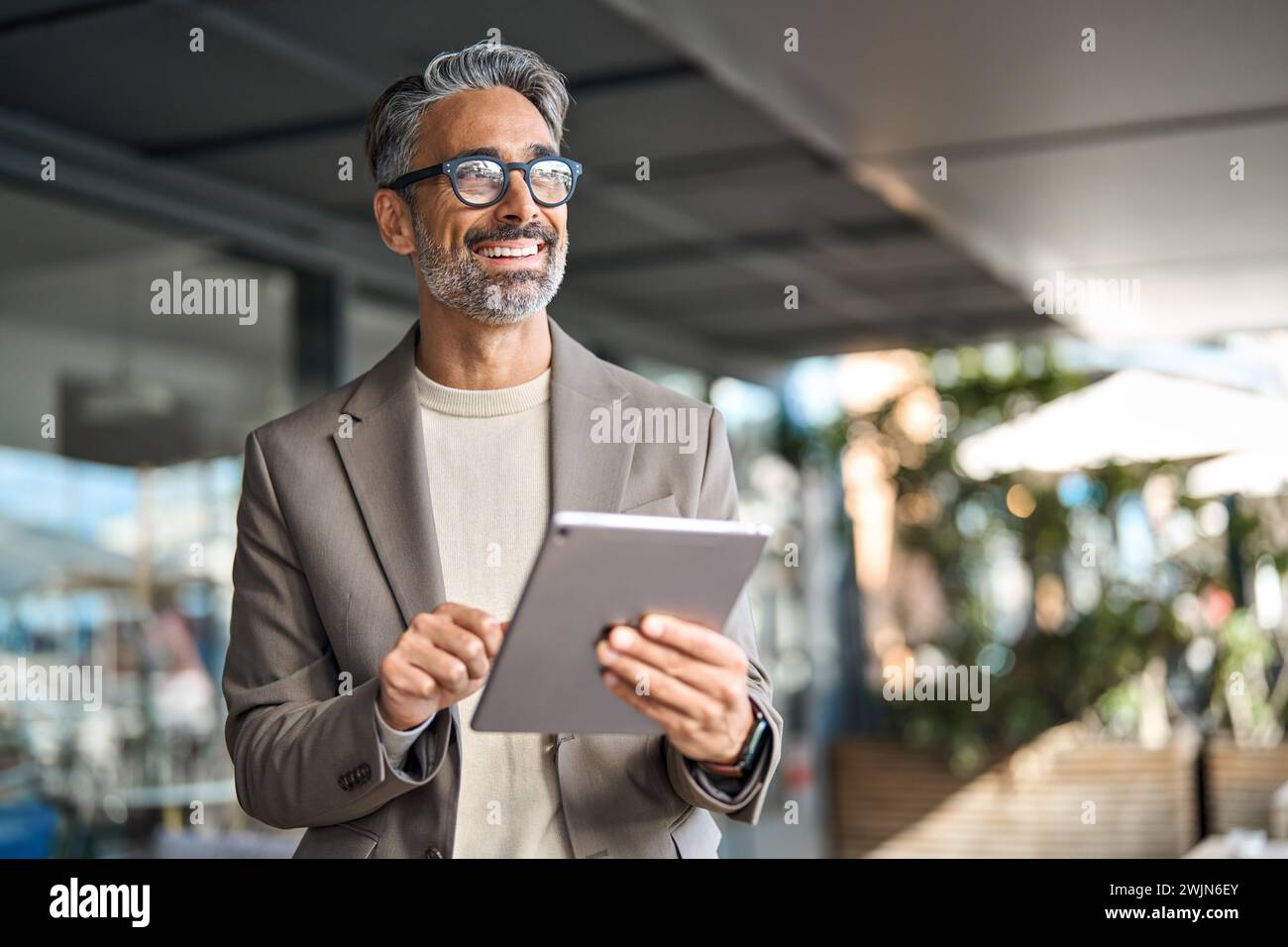 Happy middle aged professional business man executive manager using ...