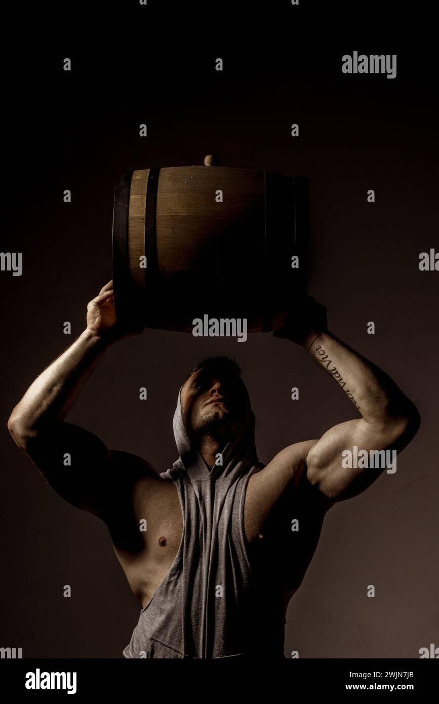 Strong man hold wooden barrel on black. Oktoberfest. Brewer man ...