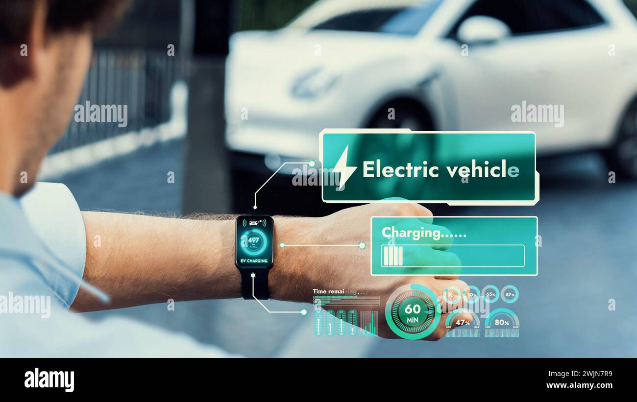 Businessman check EV car battery status on smartwatch hologram while ...