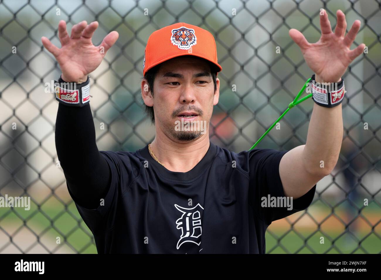 Detroit Tigers pitcher Kenta Maeda stretches during a baseball spring ...