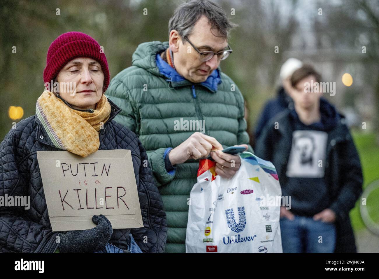 THE HAGUE - People gather at the Russian embassy in The Hague to hold a ...