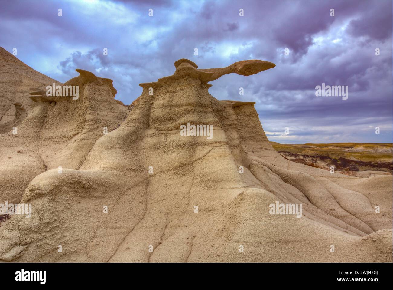 Sandstone caprocks on hoodoos in the colorful clay hills in the ...