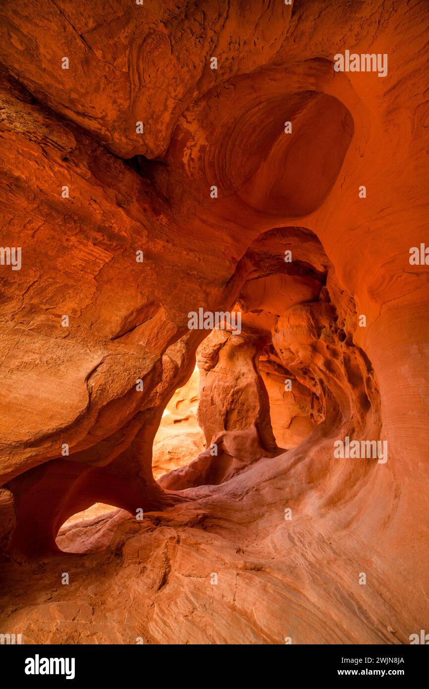 Three small arches in the colorful eroded Aztec sandstone of the Fire ...