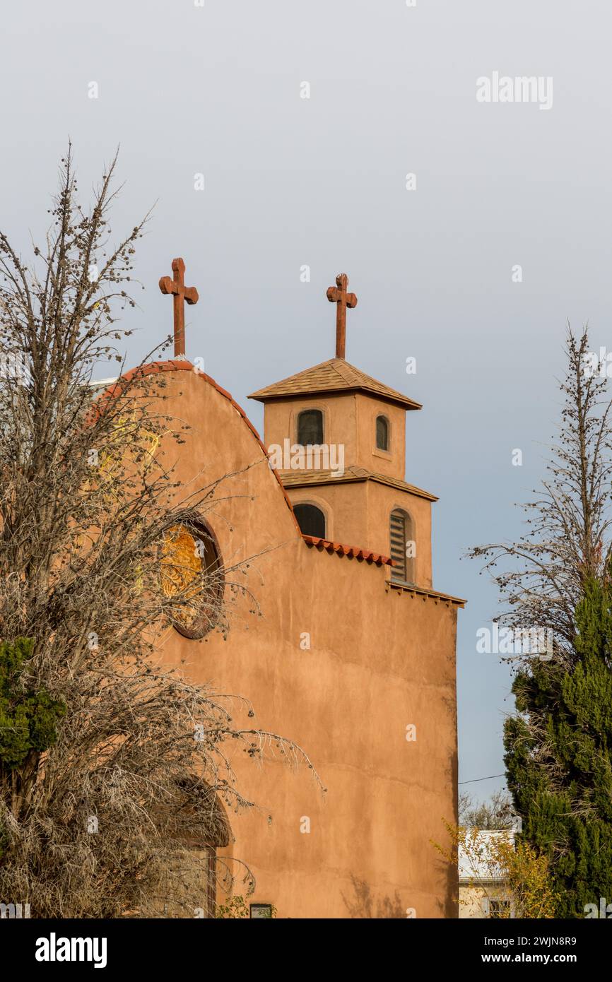 The bell towers & facade of the old mission-style Catholic parish ...