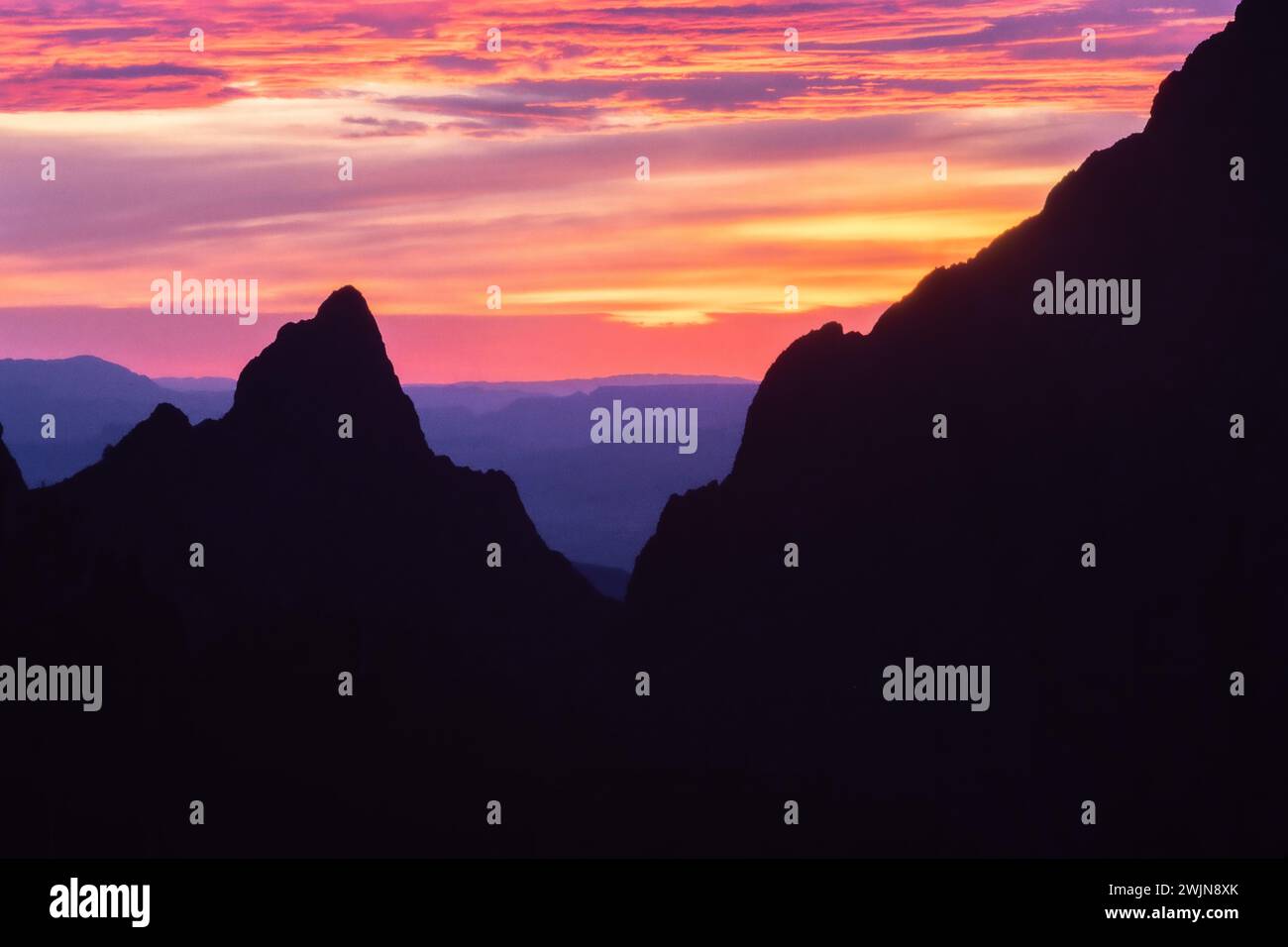 A colorful sunset at the Window in the Chisos Mountains in Big Bend ...