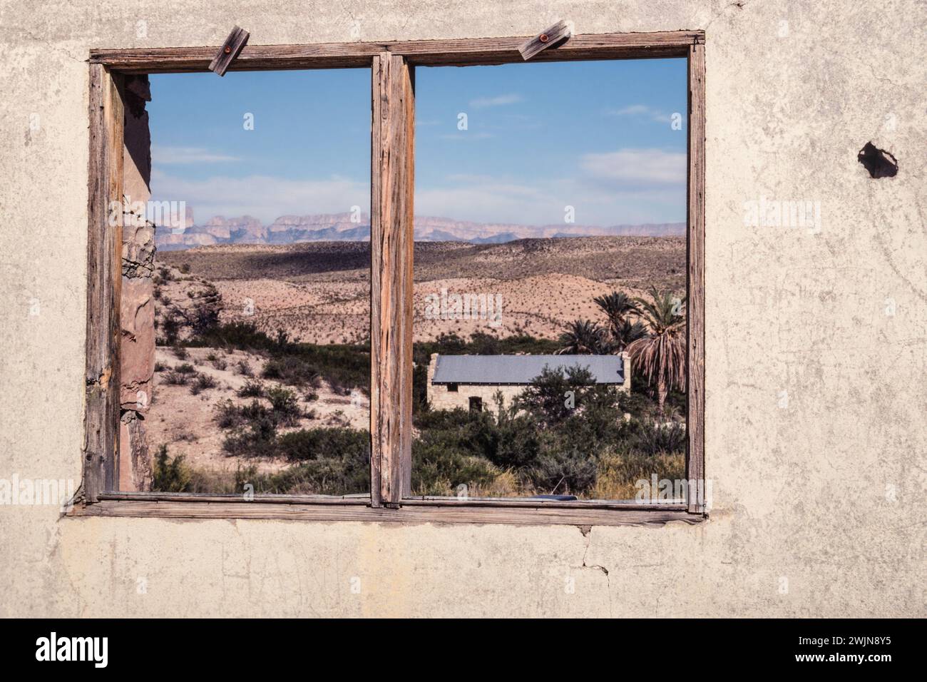 The window of an old ruin at Hot Springs frames the desert landscape ...