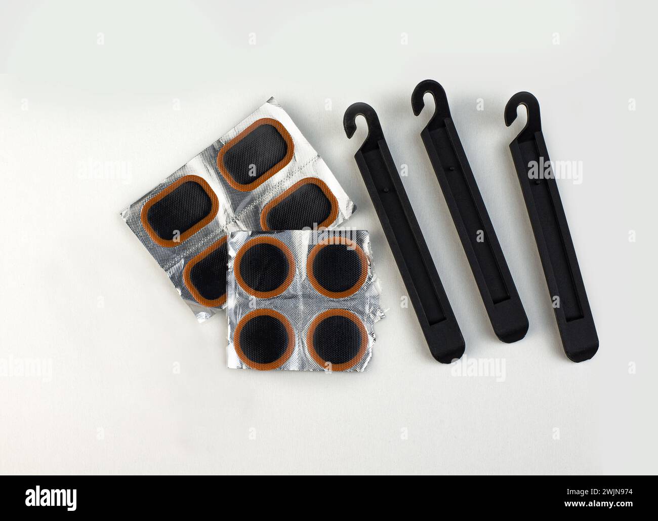 Bicycle puncture repair kit on a white Stock Photo - Alamy
