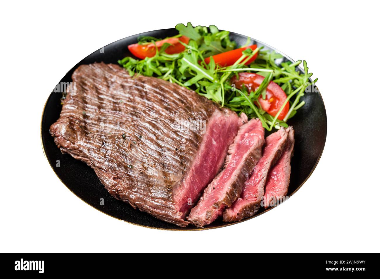 Grilled medium rare flank beef steak with salad in a plate. Isolated on ...